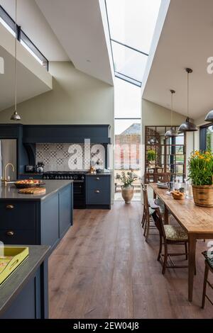 Modern kitchen in a double height space Stock Photo - Alamy