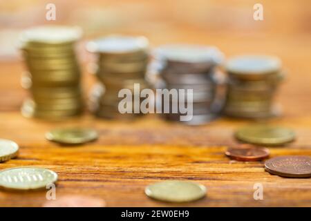 coin on wooden and brown table with copy space Stock Photo - Alamy