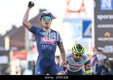 Belgian Tim Merlier celebrates as he crosses the finish line to win the ...