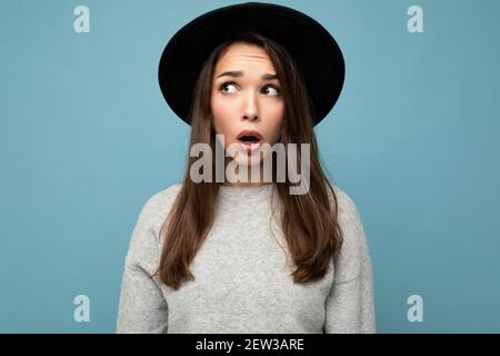 Young Black Woman Shows Shock While Holding Blank Paper in Pink ...