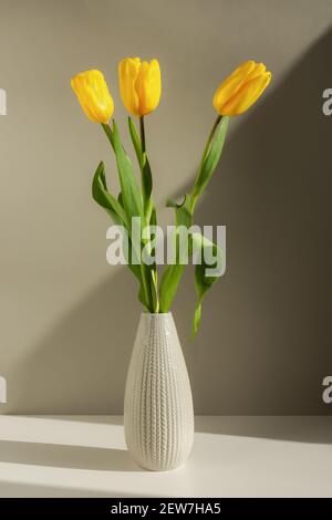 colorful tulips in a Vase with gray background and chalkboard with text ...