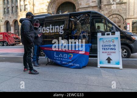 A LabQ mobile Covid-19 testing truck parked on Steinway Street in ...