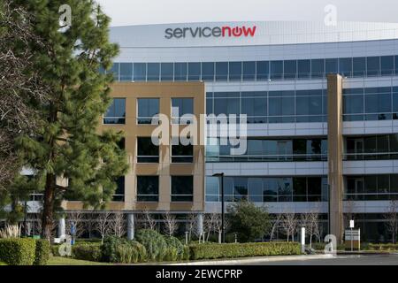 A logo sign outside of the headquarters of ServiceNow in Santa Clara ...
