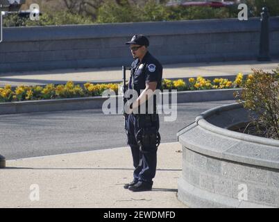 An armed United States Capitol police officer stands guard on the House ...
