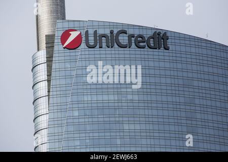A logo sign outside of the headquarters of the UniCredit Group in Milan ...