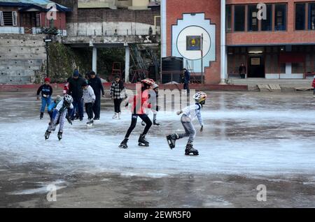 SHIMLA, INDIA - DECEMBER 27: Kids enjoying ice skating in AsiaÂ’s ...