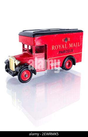Worn diecast model of a Royal Mail van. Isolated on a white background ...