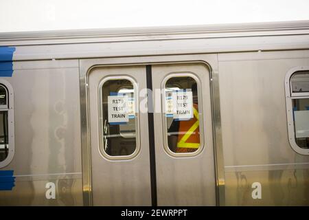 A test train consisting of new R179 subway cars runs along the elevated ...