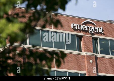 A logo sign outside of the headquarters of Emergent BioSolutions in ...