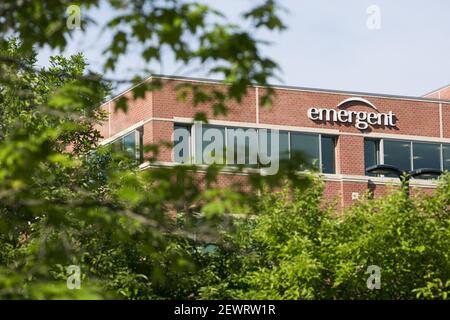 A logo sign outside of the headquarters of Emergent BioSolutions in ...