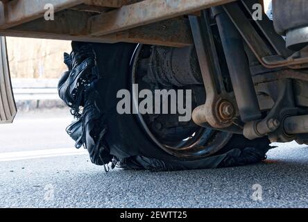 Close up of a truck with burst tyre on the motorway. Flat tire and Tire ...