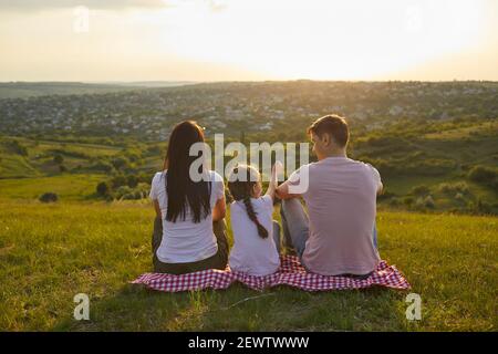Summer - girl at the picnic in the meadow. Cheese brie, baguette ...