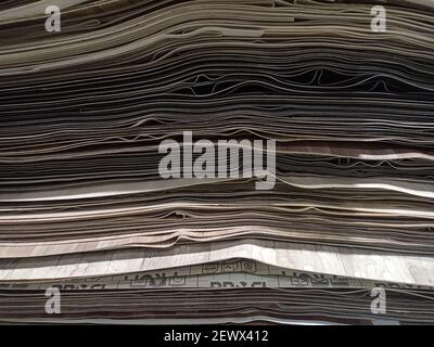 A pile of remnants of pieces of linoleum stacked on top of each other ...
