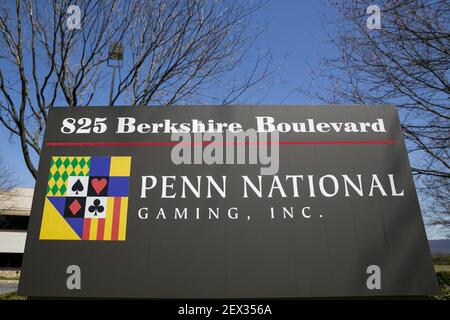 A logo sign outside the headquarters of Penn National Gaming, Inc., in ...