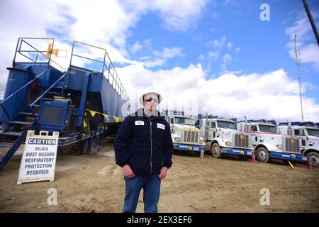 Schlumberger trucks with 2000 horsepower pumps direct water, sand and ...