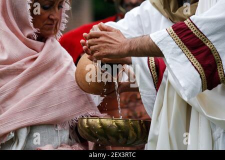 Pilate washes his hands; Passion of Christ. Pontius Pilatus is sitting ...
