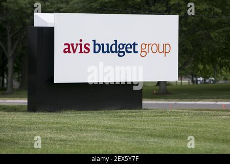 A logo sign outside of the headquarters of Avis Budget Group, Inc., in ...