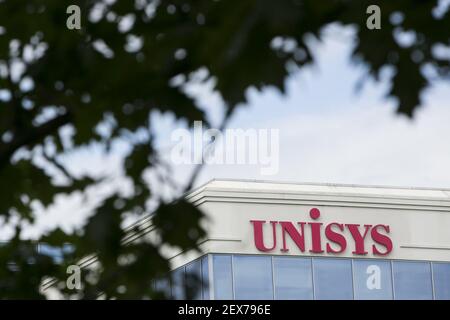 A logo sign outside of the headquarters of Unisys Corporation in Blue ...