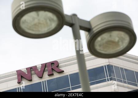 A logo sign outside of the headquarters of NVR, Inc., the parent ...