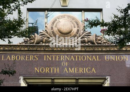 A logo sign outside of the headquarters of the Laborers' International ...