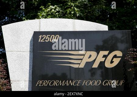 A logo sign outside of the headquarters of the Performance Food Group ...