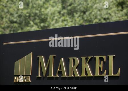 A logo sign outside of the headquarters of the Markel Corporation in ...