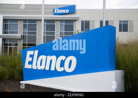 A logo sign outside of the headquarters of Elanco Animal Health, in ...