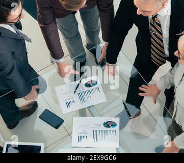 Group of people working at desk top view Stock Photo - Alamy