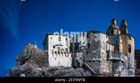A small fishing village located on seashore against the backdrop of ...