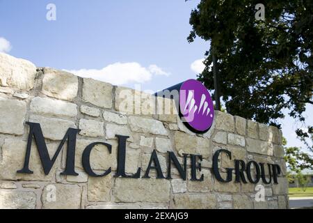 A logo sign outside of the headquarters of the McLane Group in Temple ...