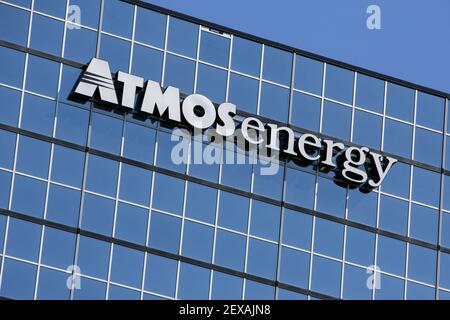 A logo sign outside of the headquarters of The Atmos Energy Corporation ...