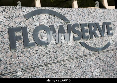 A logo sign outside of the headquarters of The Flowserve Corporation in ...