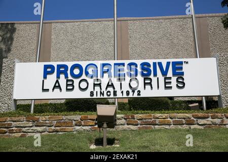 A logo sign outside of the headquarters of Progressive Leasing in ...