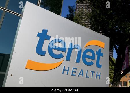 A logo sign outside of the headquarters of the Tenet Healthcare ...