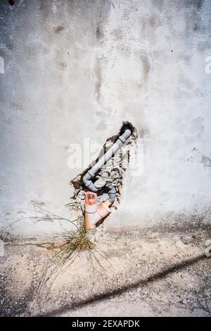 Old rundown building with exposed pipe Stock Photo - Alamy
