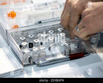 03rd Mar, 2021. COVID-19 vaccinations A medical worker gets a Pfizer ...