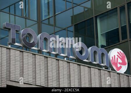 A logo sign outside of the headquarters of TomTom NV in Amsterdam ...