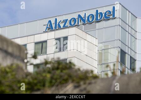 A logo sign outside of the headquarters of AkzoNobel in Amsterdam ...