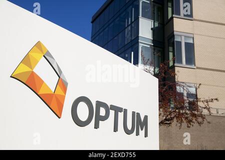 A logo sign outside of the headquarters of Optum in Eden Prairie ...