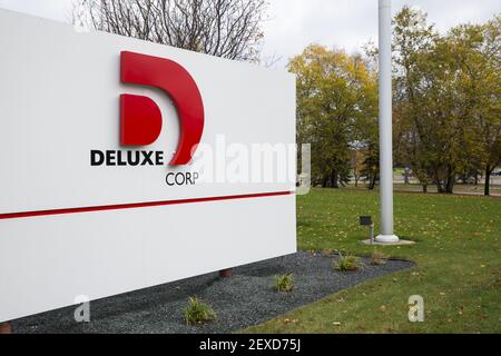 A logo sign outside of the headquarters of the Deluxe Corporation in ...