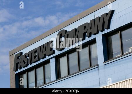 A logo sign outside of the headquarters of the Fastenal Company in ...