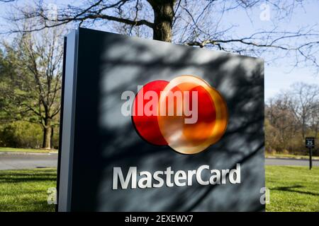 A logo sign outside of the headquarters of MasterCard Worldwide in ...