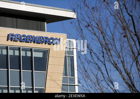A logo sign outside of the headquarters of Regeneron Pharmaceuticals ...