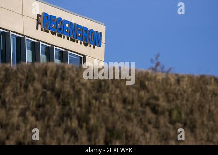 A logo sign outside of the headquarters of Regeneron Pharmaceuticals ...