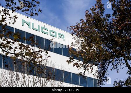 A logo sign outside of the headquarters of the Nucor Corporation in ...