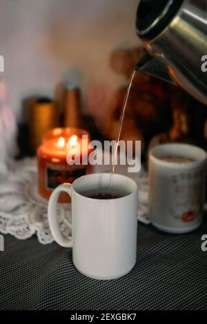 Cozy still life of tea, christmas light and pastry Stock Photo - Alamy