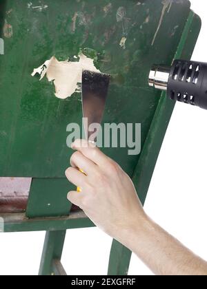 Person removing paint with chisel Stock Photo - Alamy