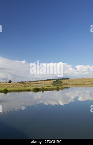 side view of river dam with road on top of the dam Stock Photo - Alamy