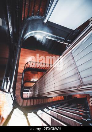 An old square spiral stairway case from above Stock Photo - Alamy