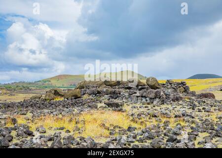 Fallen toppled moai (statues) on the ruined platform at Ahu Akahanga on ...